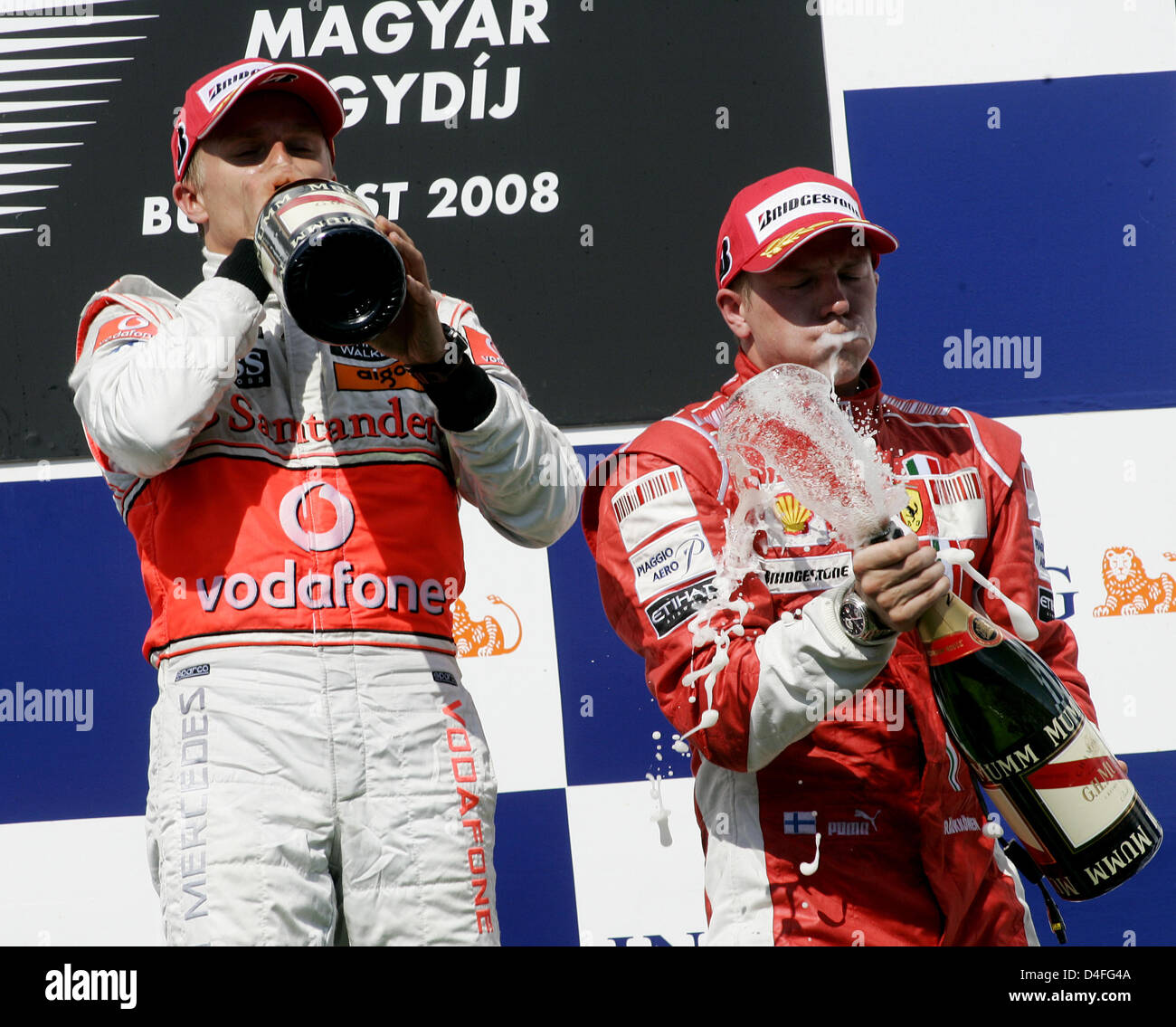 Finnish Formula One driver Heikki Kovalainen (L) of McLaren Mercedes ...