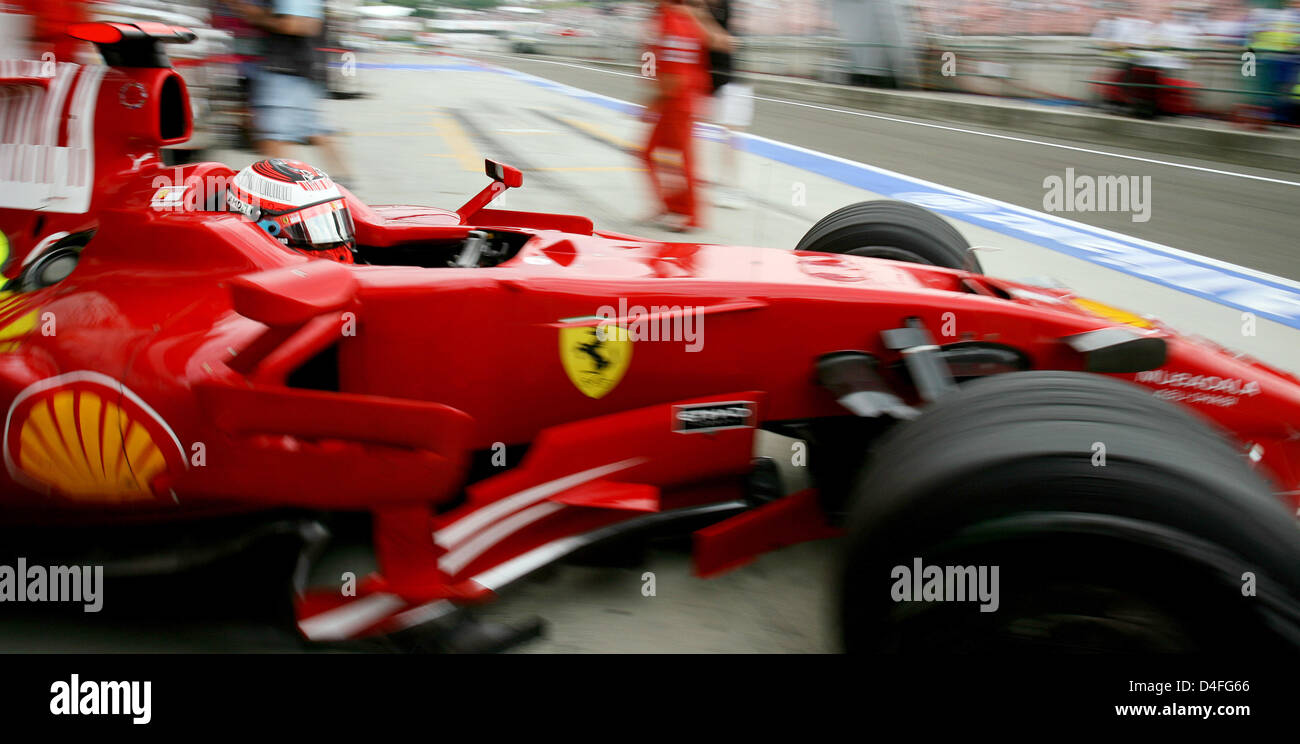 Finnish Formula One driver Kimi Raikkonen of Ferrari starts from his ...