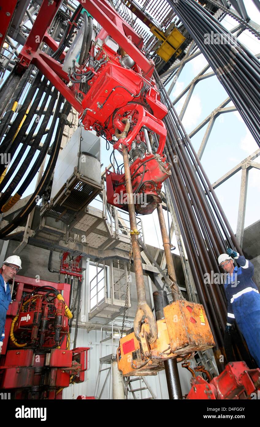 Men working on drilling rig Mittelplate, Germany, 04 August 2008 ...