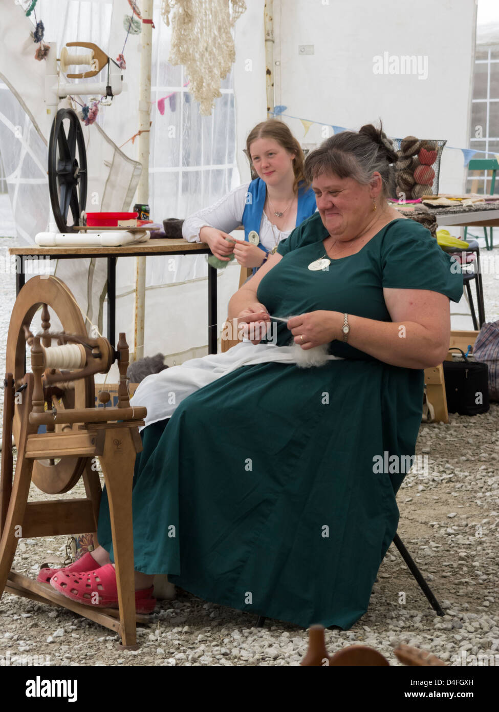 Women demonstrating the ancient craft of hand spinning techniques in ...