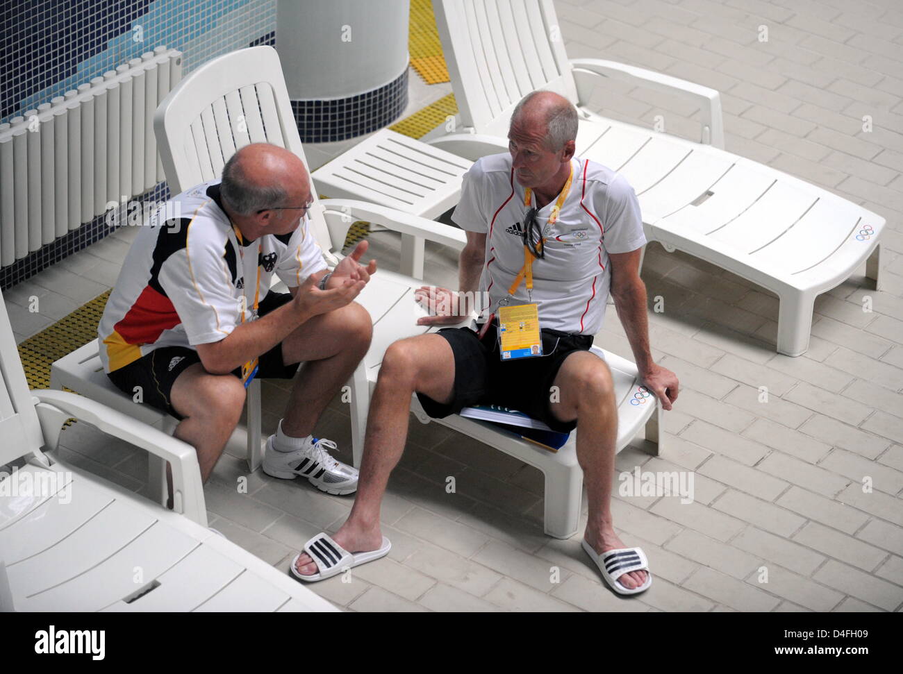 German head coach Oerjan Madsen (R) of Norway talks with German coach ...