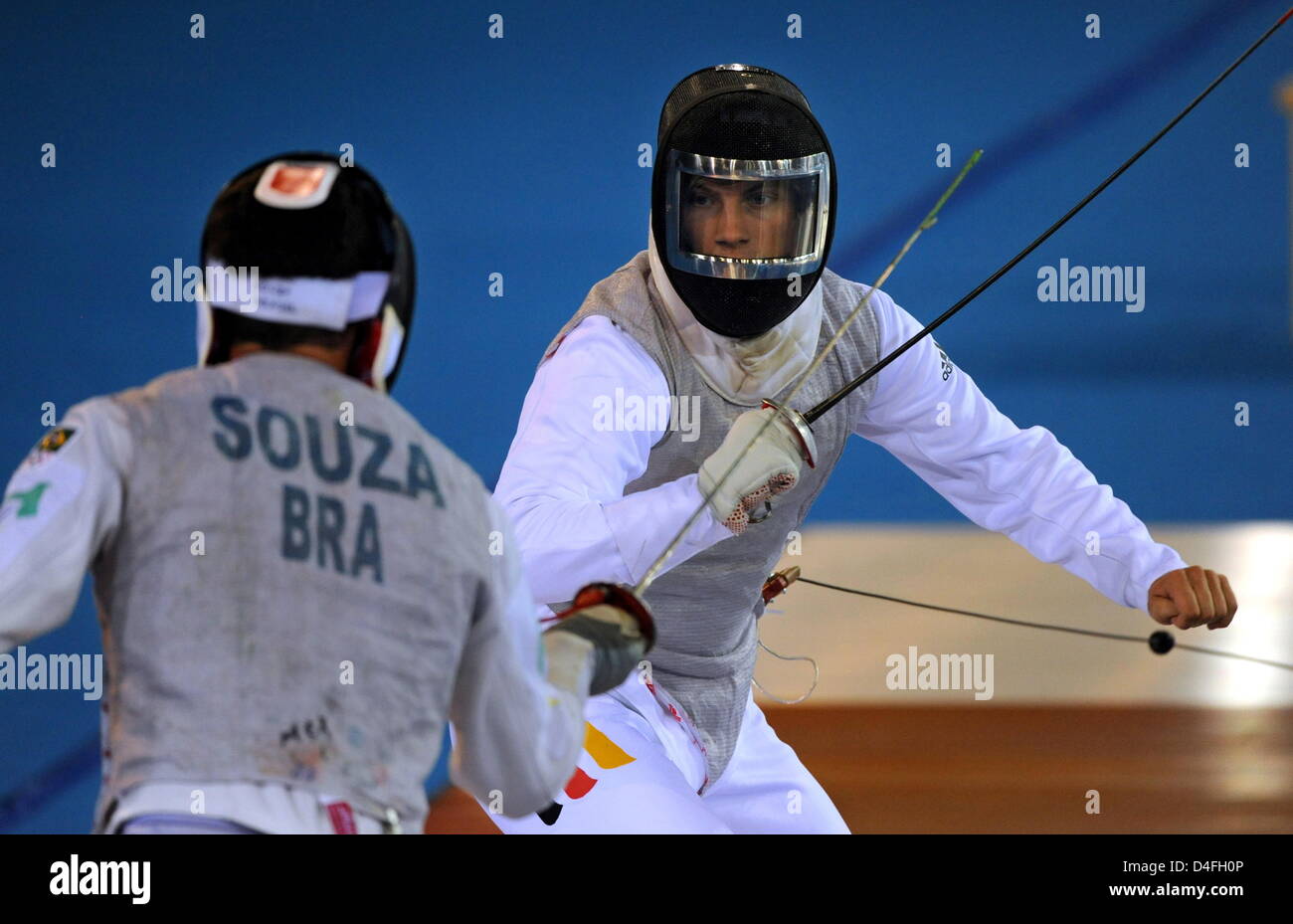 German fencer Peter Joppich (R) fights against Brazilian Joao Antonio ...
