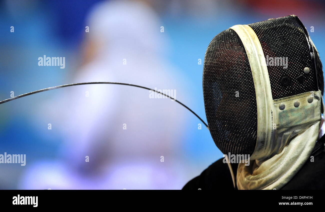 A fencer gets hit during a practice session in the Fencing Hall of the ...
