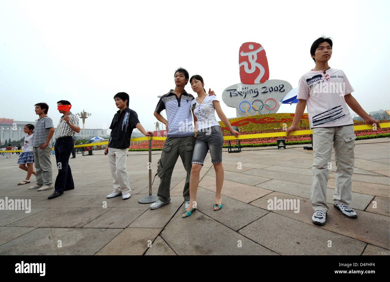 Chinese people are posing for a photo at the Tian `anmen square in ...