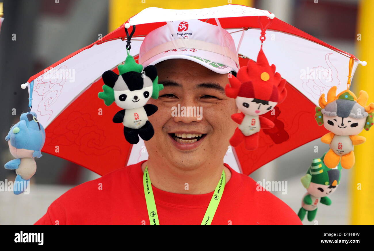 A chinese supporter wearing a funny hat in front of the National ...