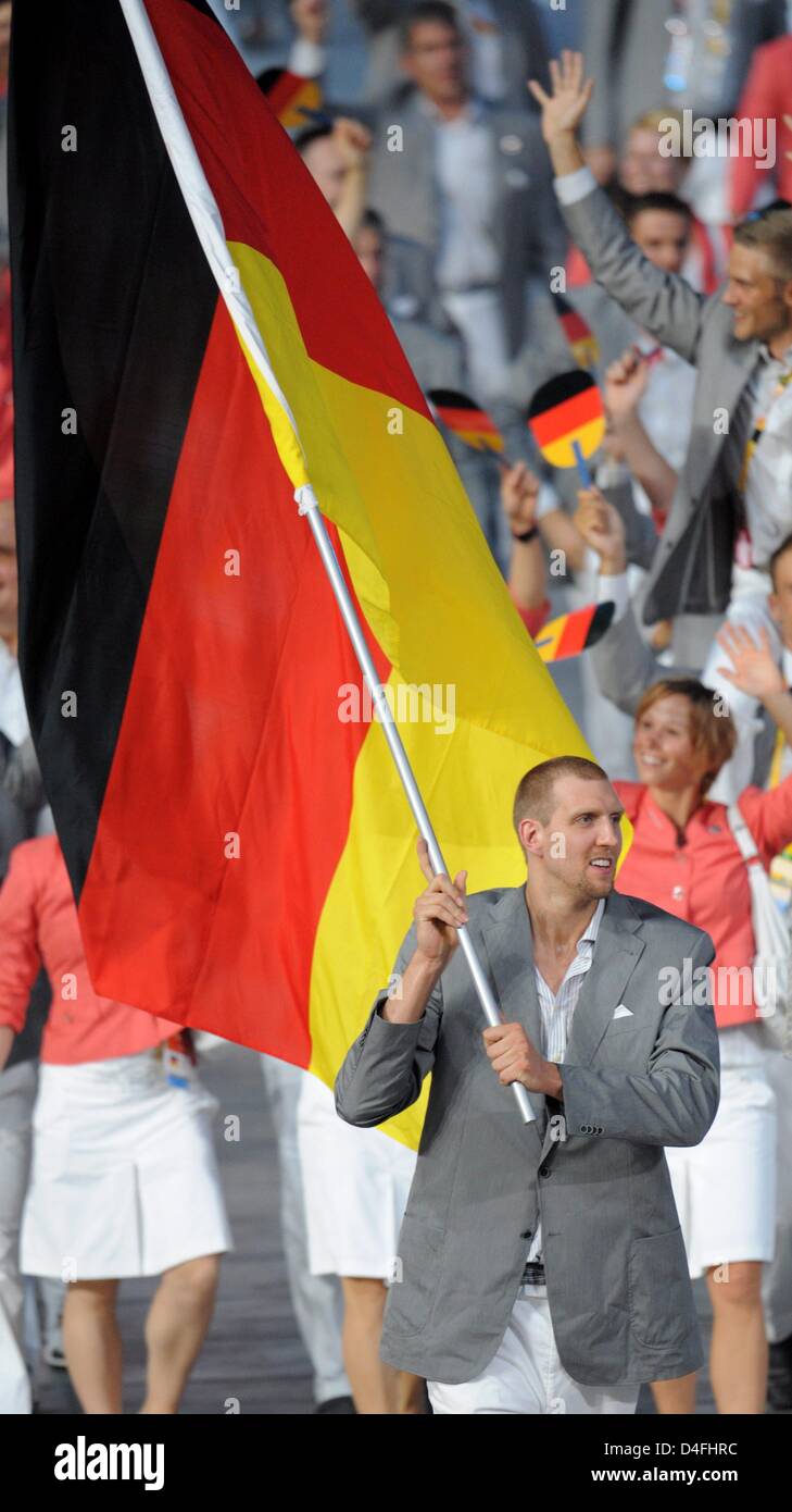 German flag bearer Dirk Nowitzky leads the team into the stadium during ...