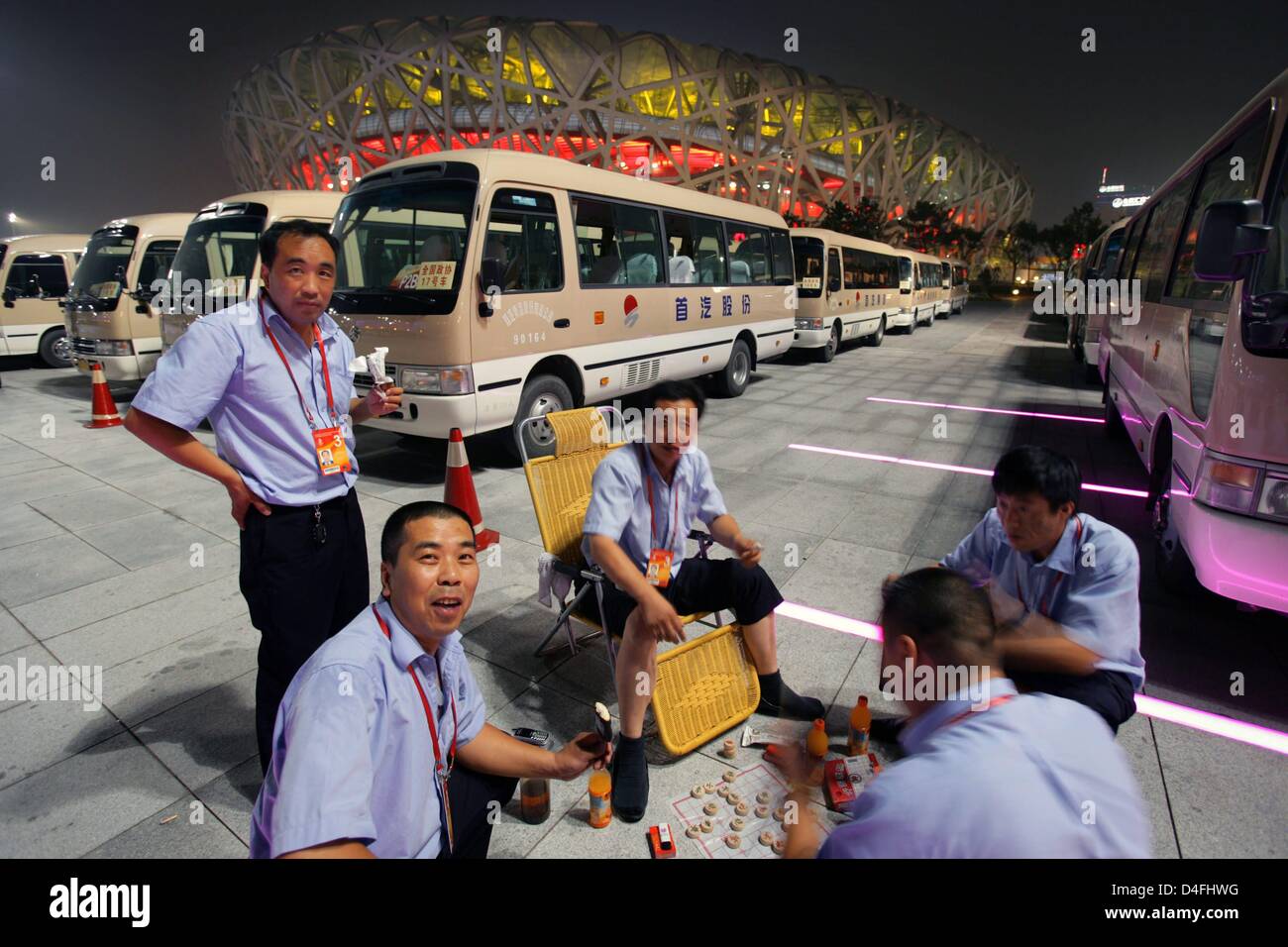 Bus drivers play a game on the car-park during the Opening Ceremony of ...