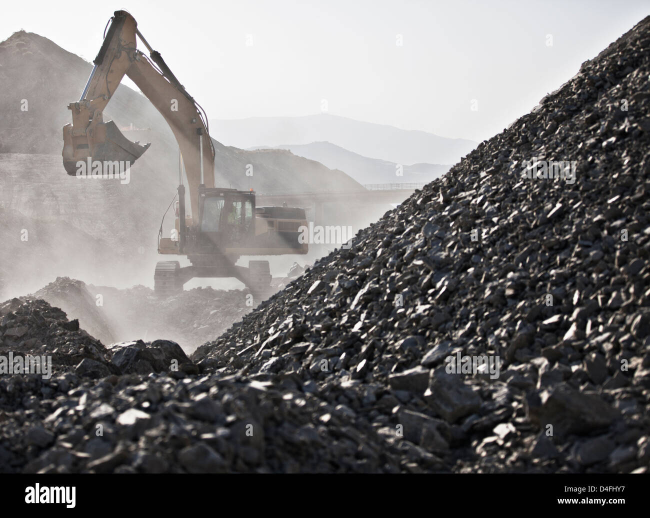 Digger working in quarry Stock Photo - Alamy