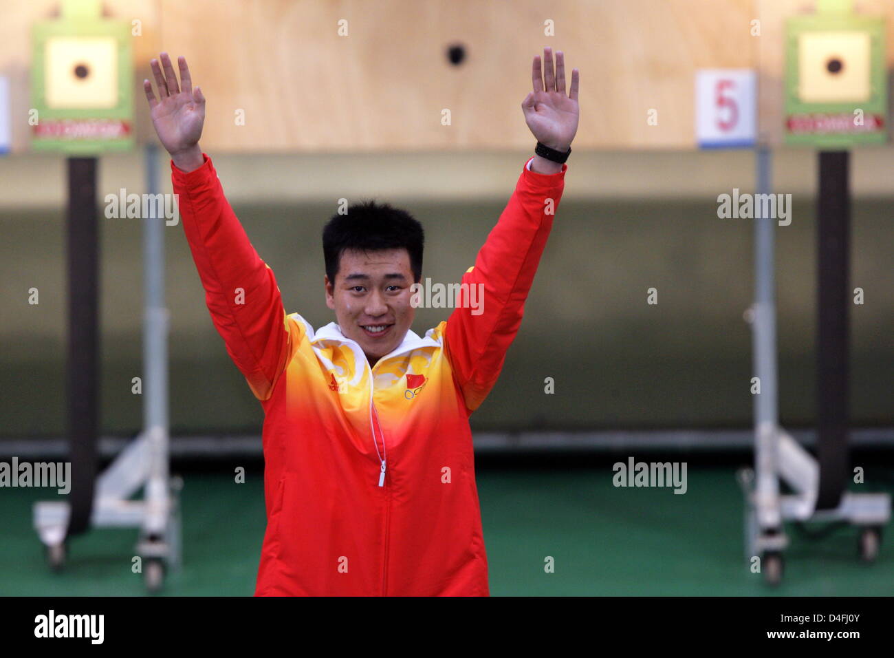 Gold medal winner Chinese Wei Pang celebrates during the medal ceremony ...