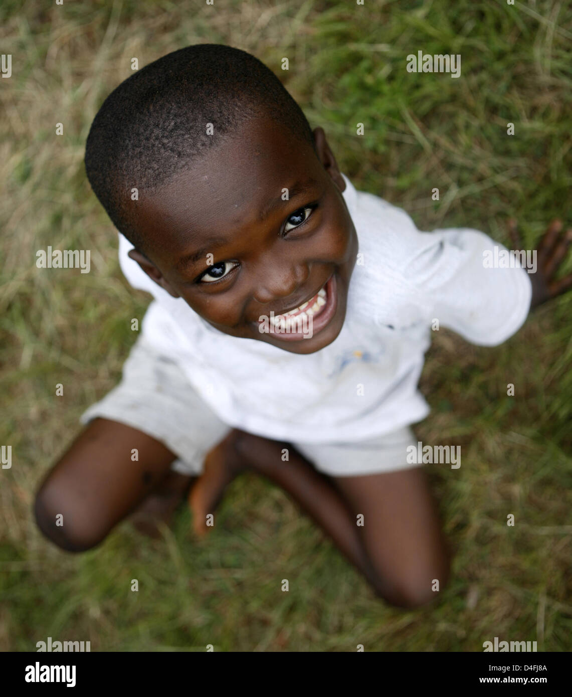 A Ghanaian boy smiles to the camera in Apimsu, Ghana, 17 June 2008 ...
