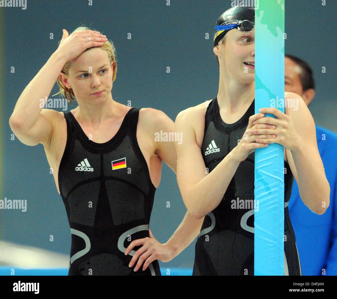 German swimmers Britta Steffen (L) and Meike Freitag look dejected ...