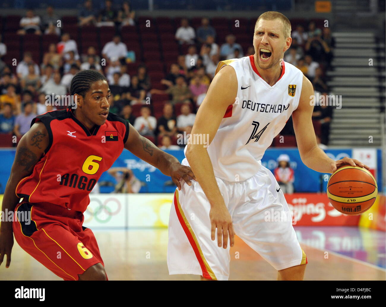 The german basketball player Dirk Nowitzki (R) fight for the ball with ...