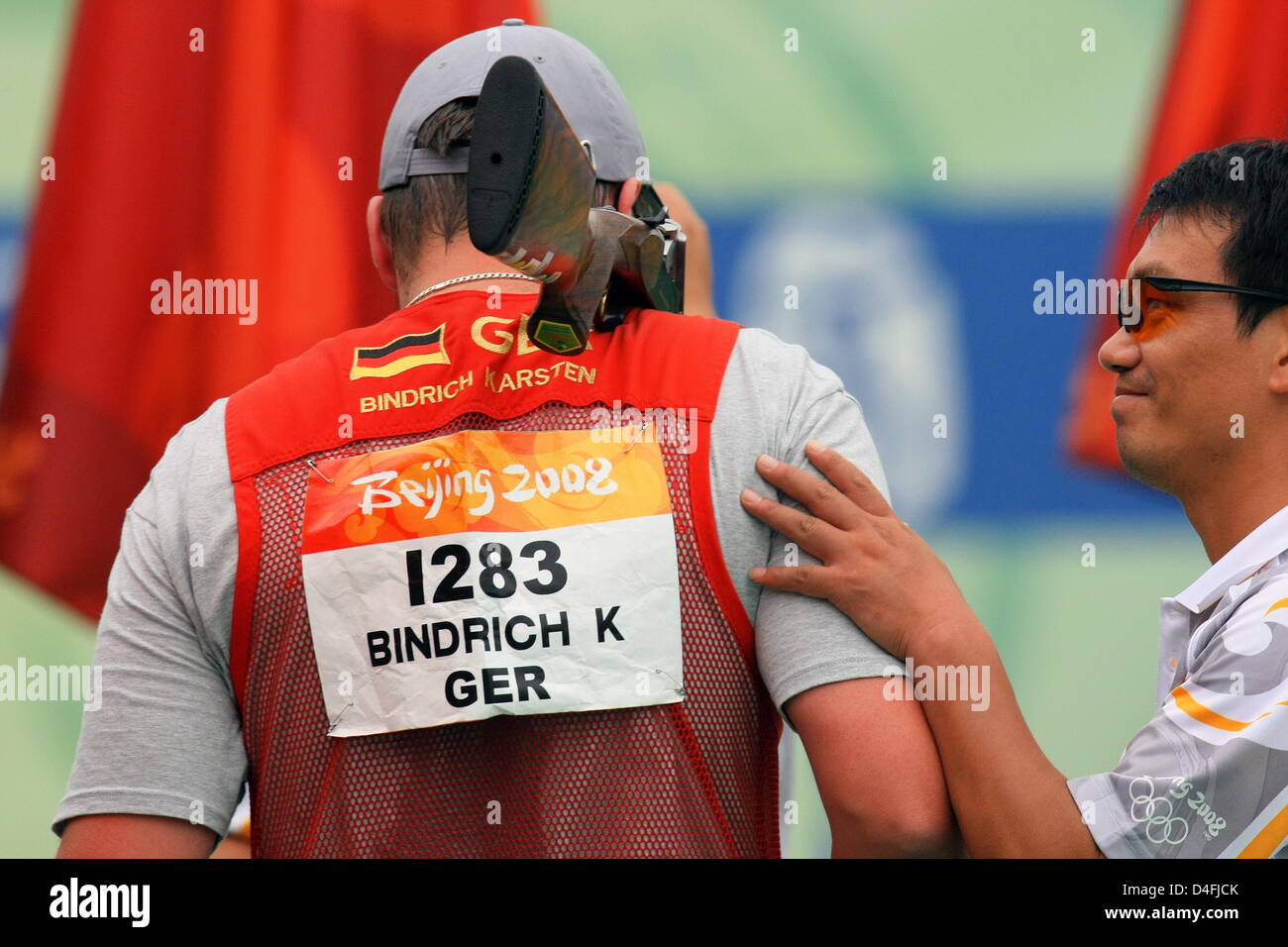 German Karsten Bindrich leaves the shooting range after the men's trap shooting qualification in ...