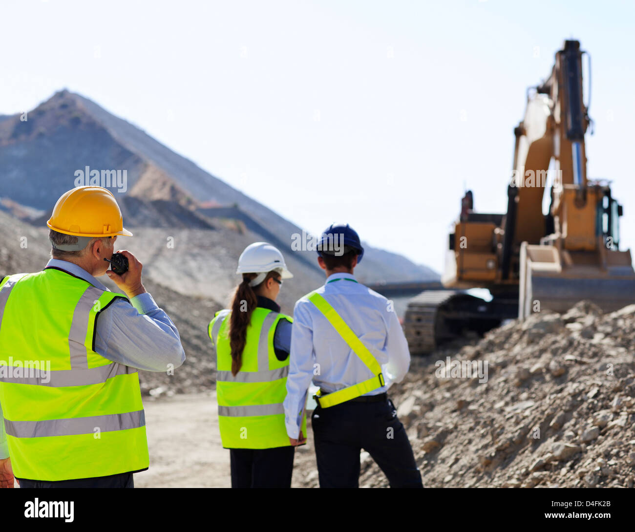 Business people talking in quarry Stock Photo - Alamy