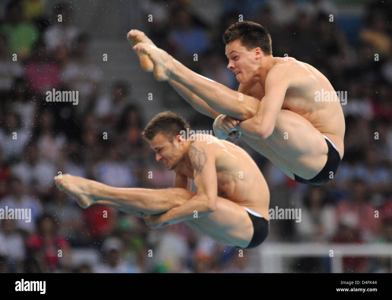 Divers Sascha Klein (L) and Patrick Hausding of Germany compete during ...