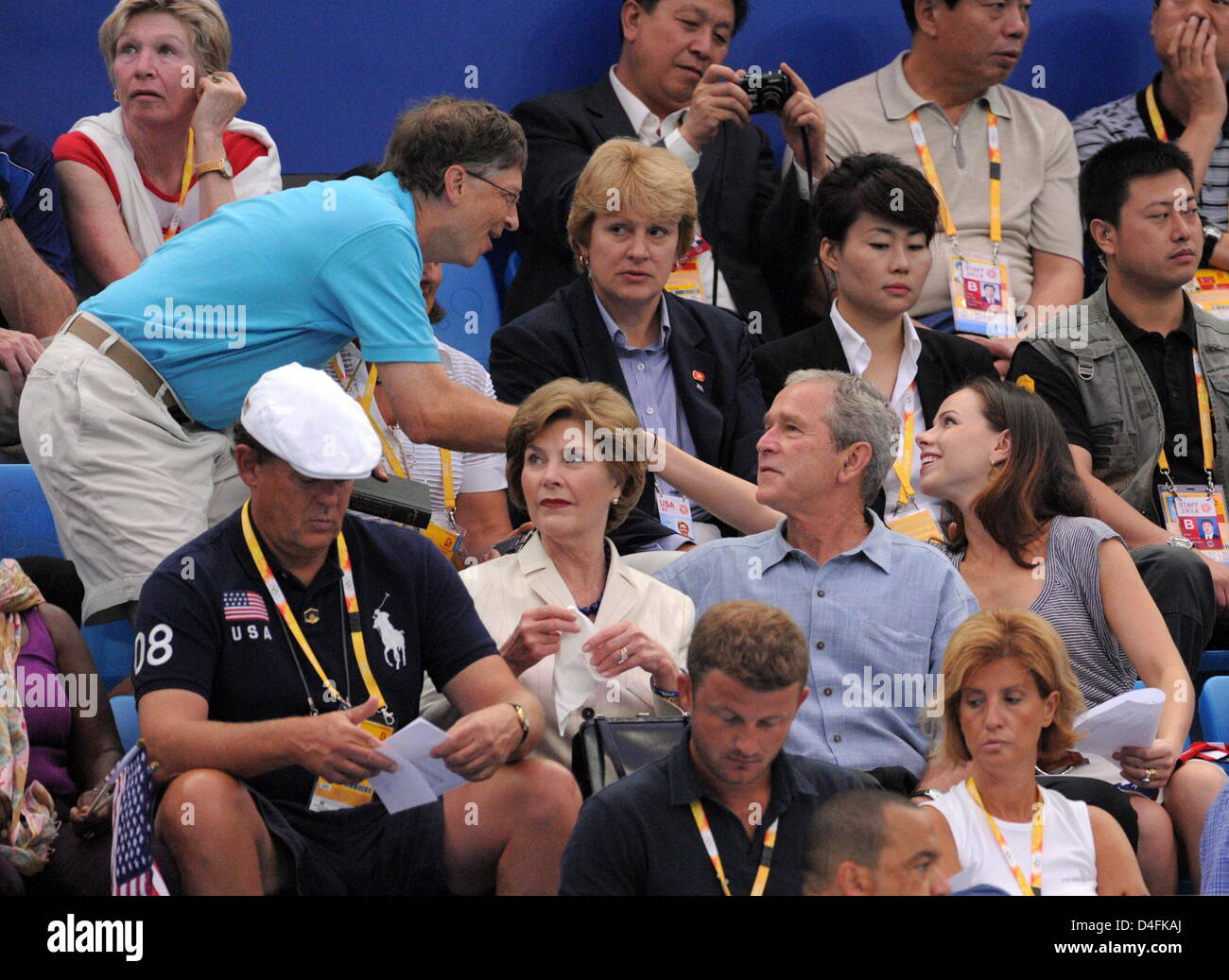 Bill Gates (L) greets Barbara Bush (R) while US President George W ...