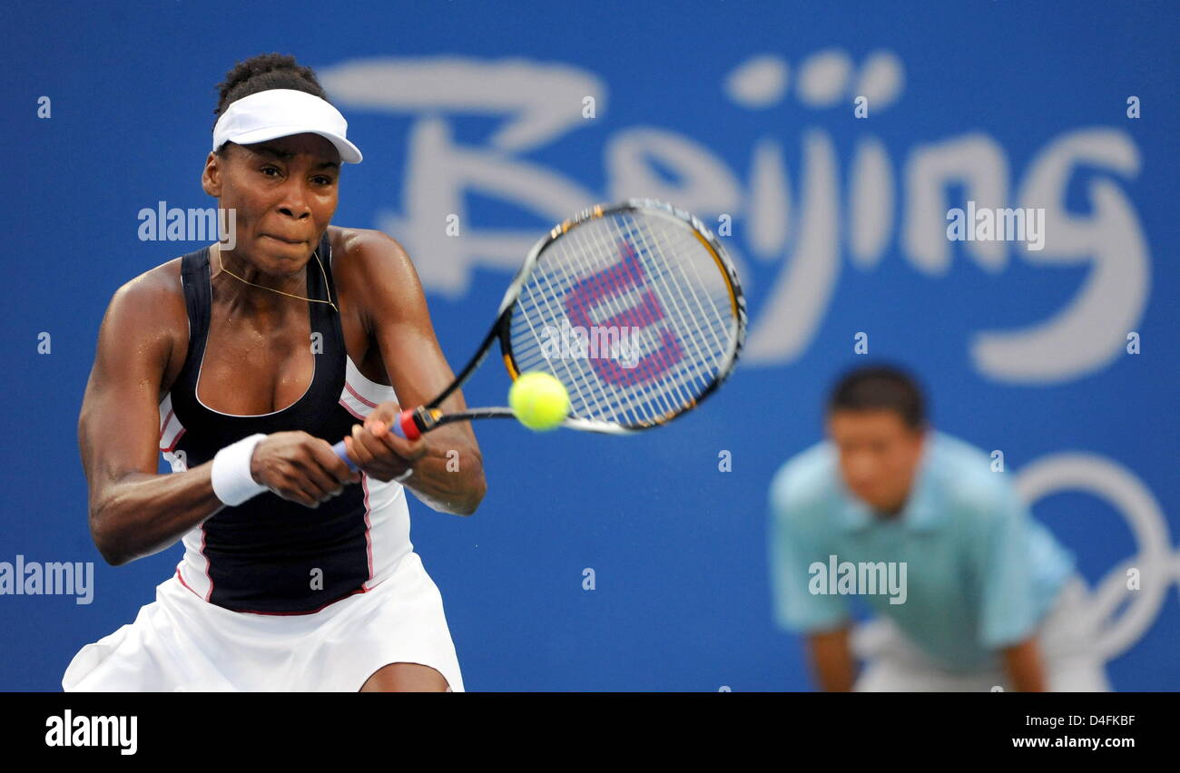 Venus Williams of US returns a shot of Bacsinsky of Switzerland during ...