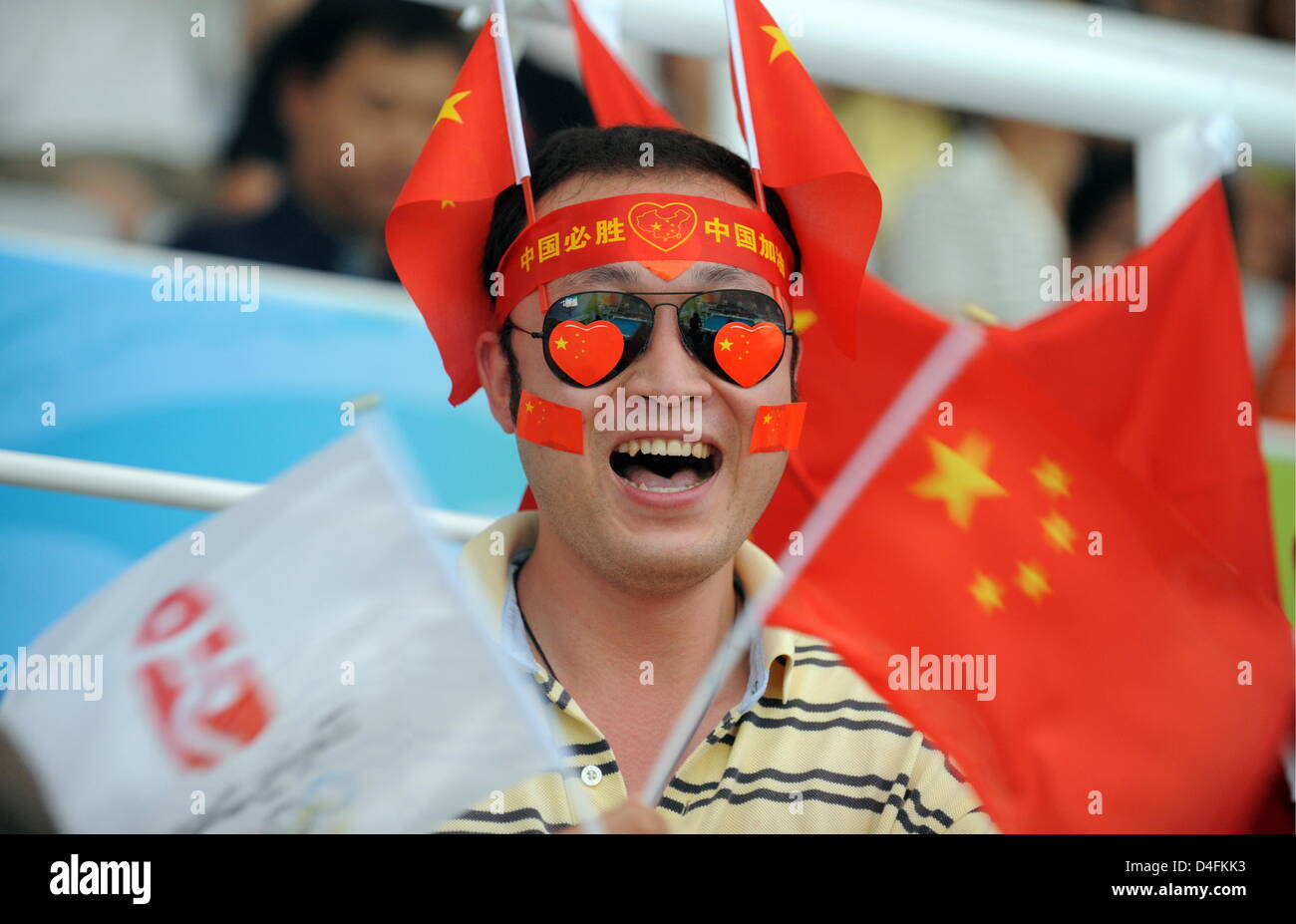 Chinese supporter cheers during women's synchronised 10m Platform final ...