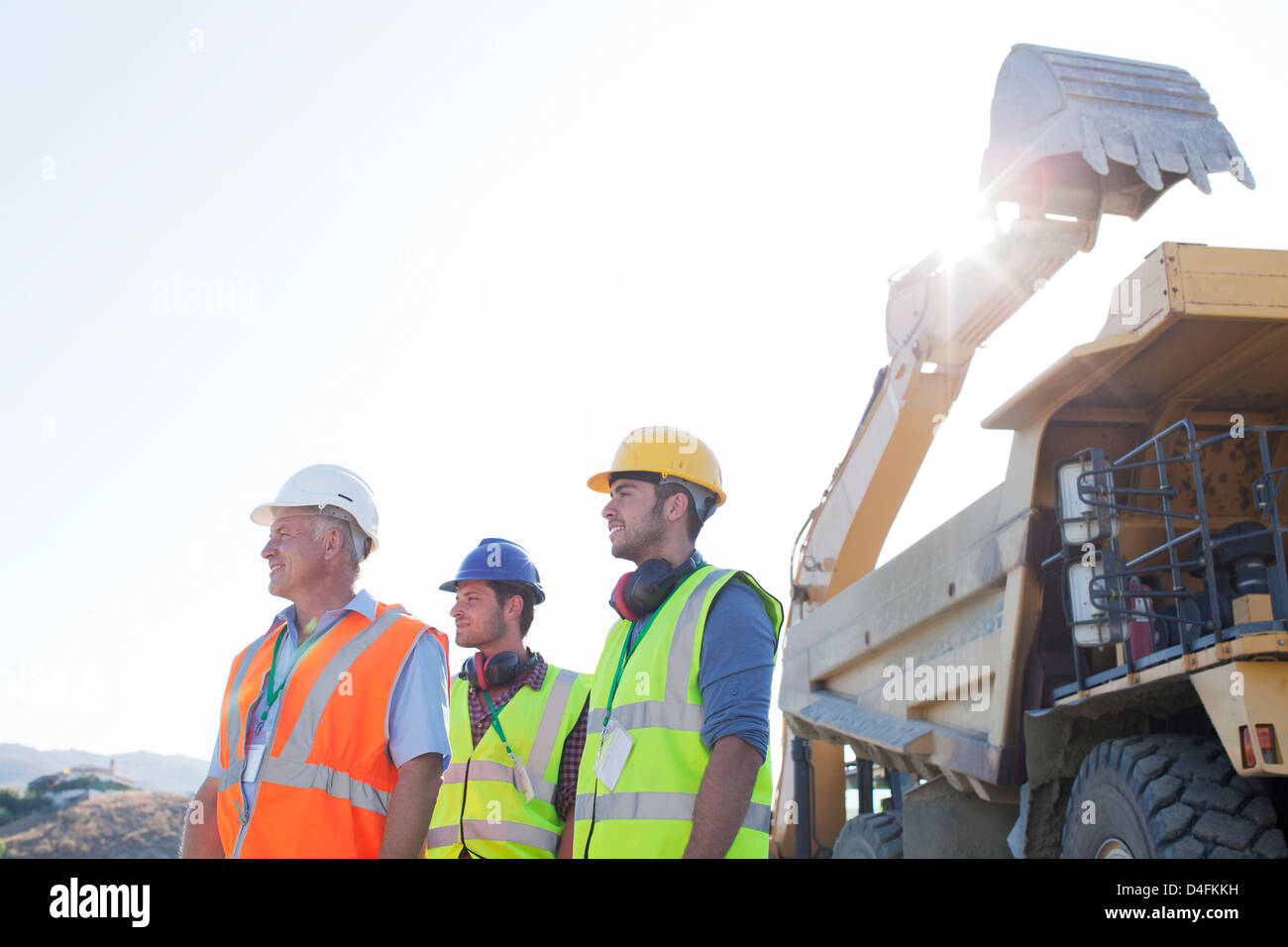 Workers standing on site Stock Photo - Alamy