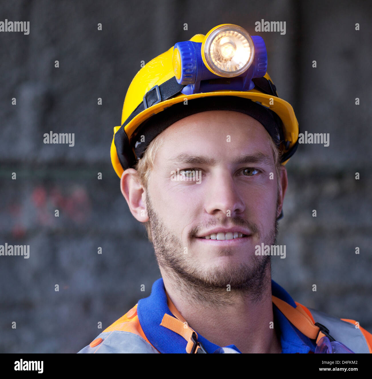 Close up of worker's smiling face Stock Photo - Alamy