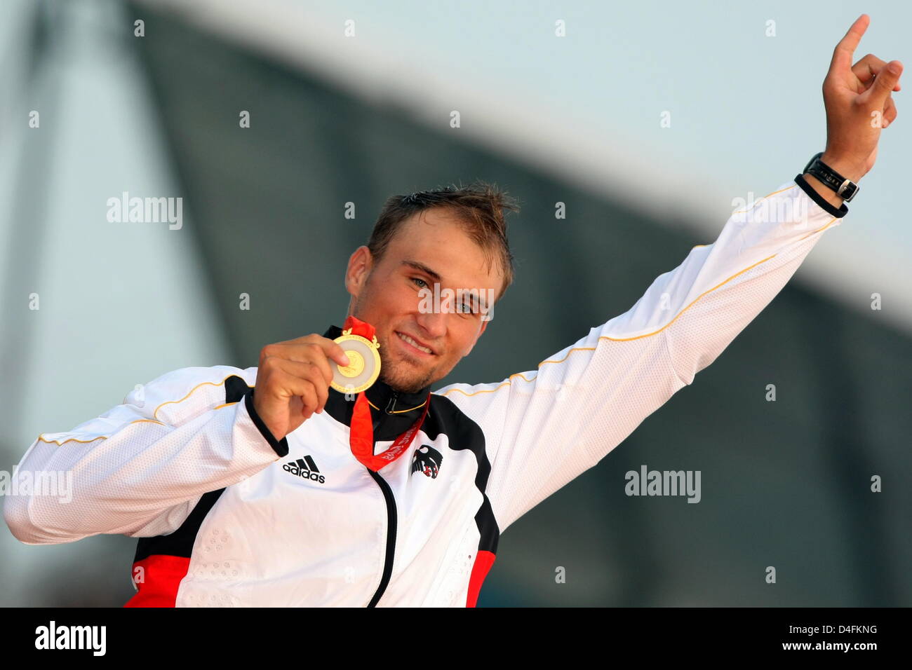 German Alexander Grimm celebrates on the podium with his goldmedal ...