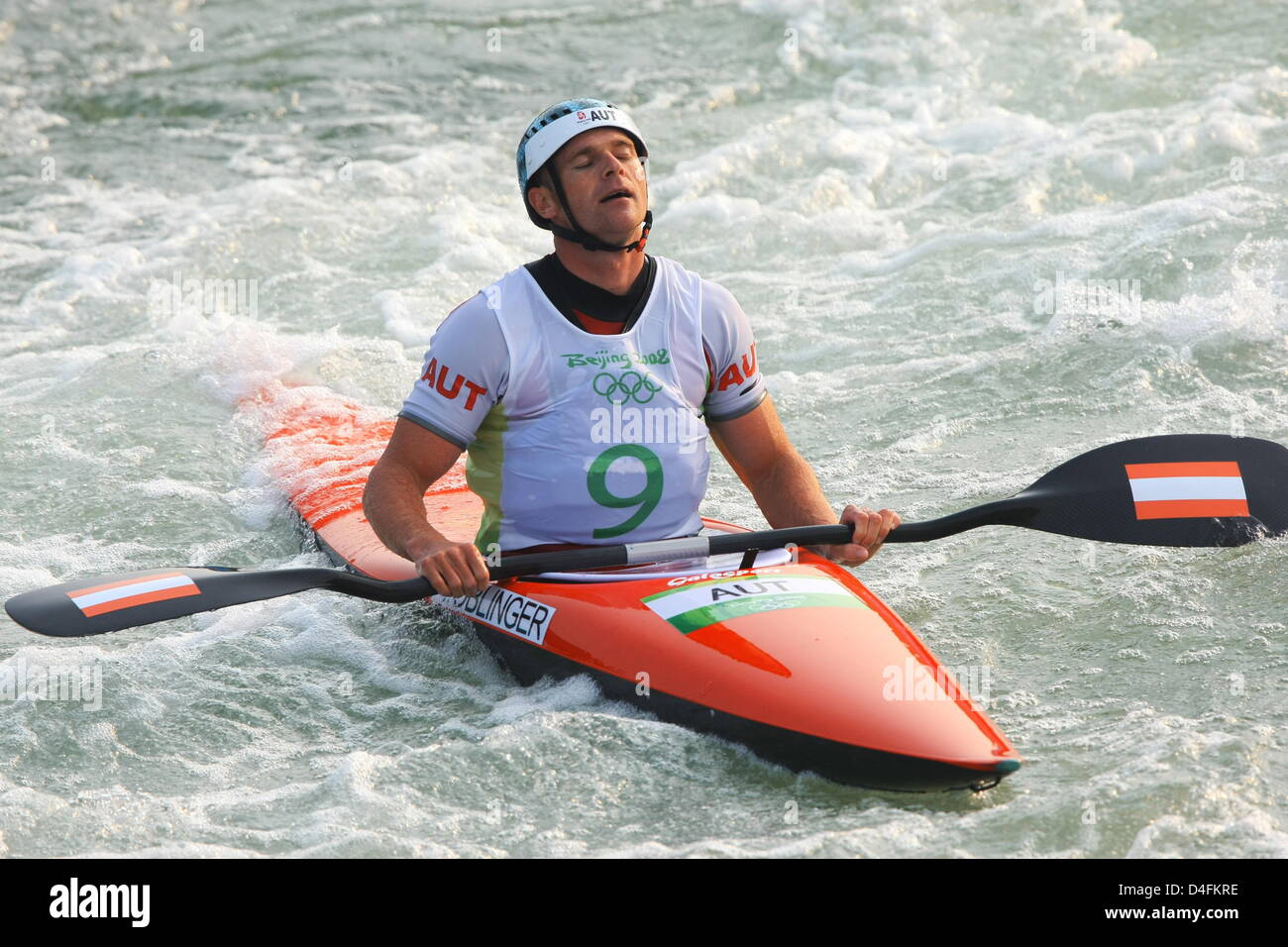 Helmut Oblinger from Austria seen exhausted after the the Olympic Kayak Slalom final at Shunyi ...