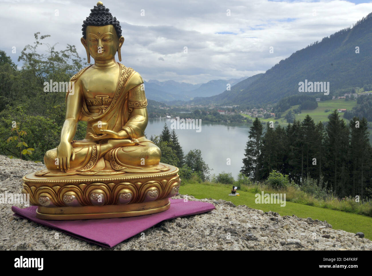 A 'Buddha' statue seen in front of an Alpine scenery near Immenstadt ...
