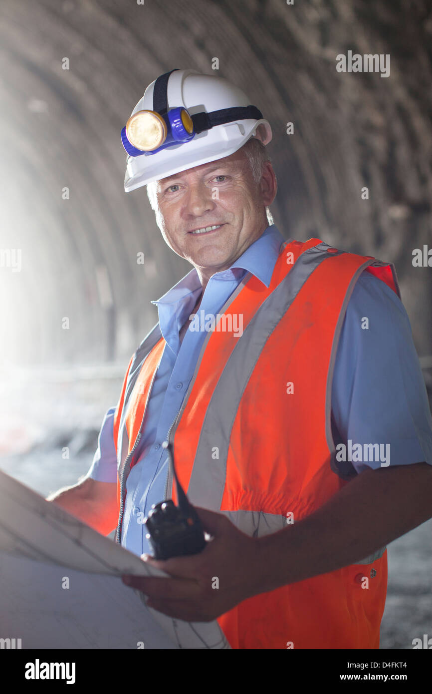 Worker reading blueprints on site hi-res stock photography and images ...