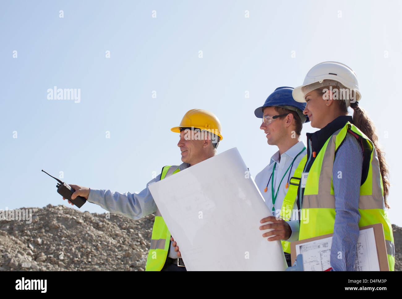 Business people talking in quarry Stock Photo - Alamy