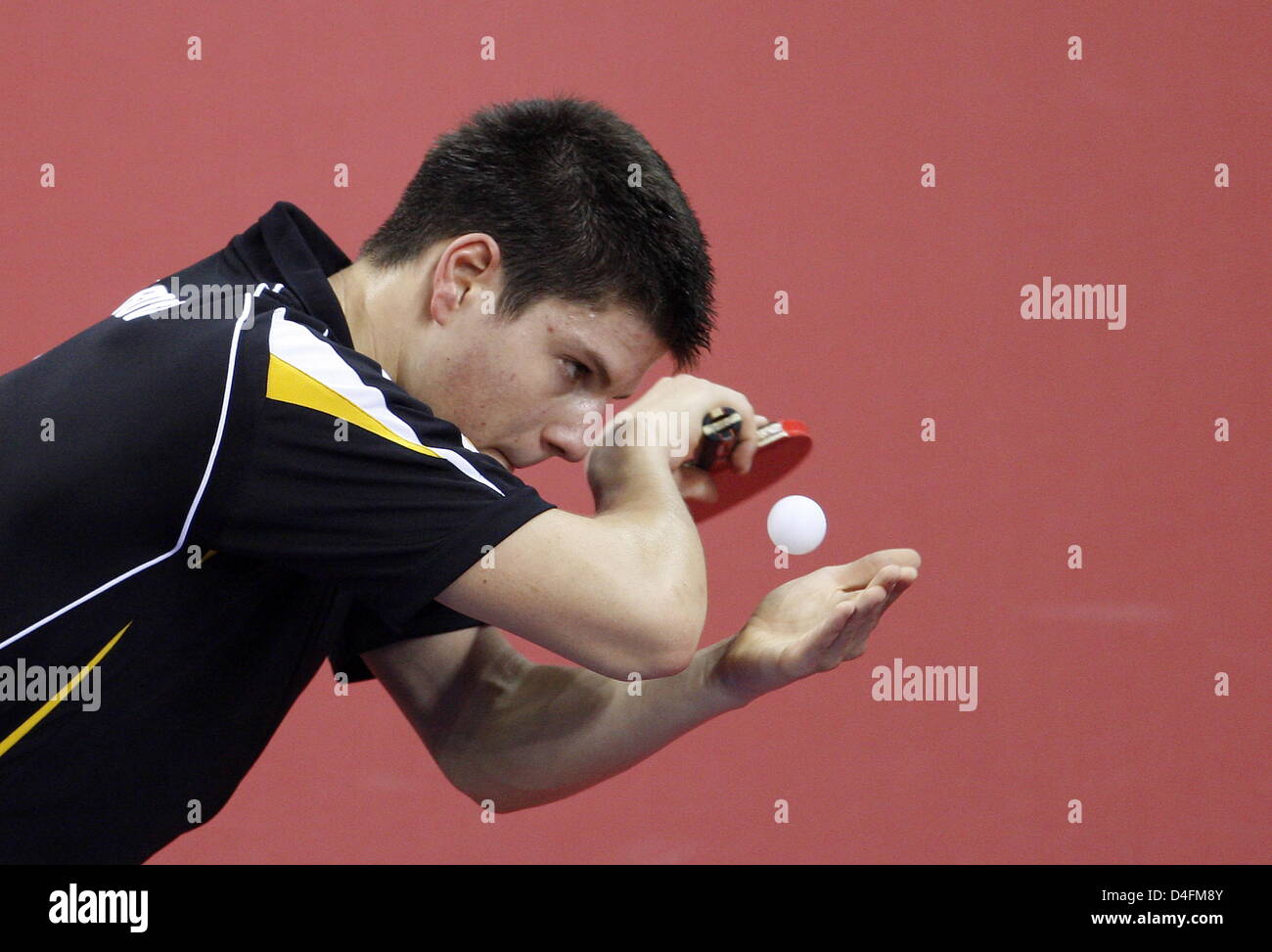 Dimitrij Ovtcharov of Germany serves the ball during the menÒs team ...
