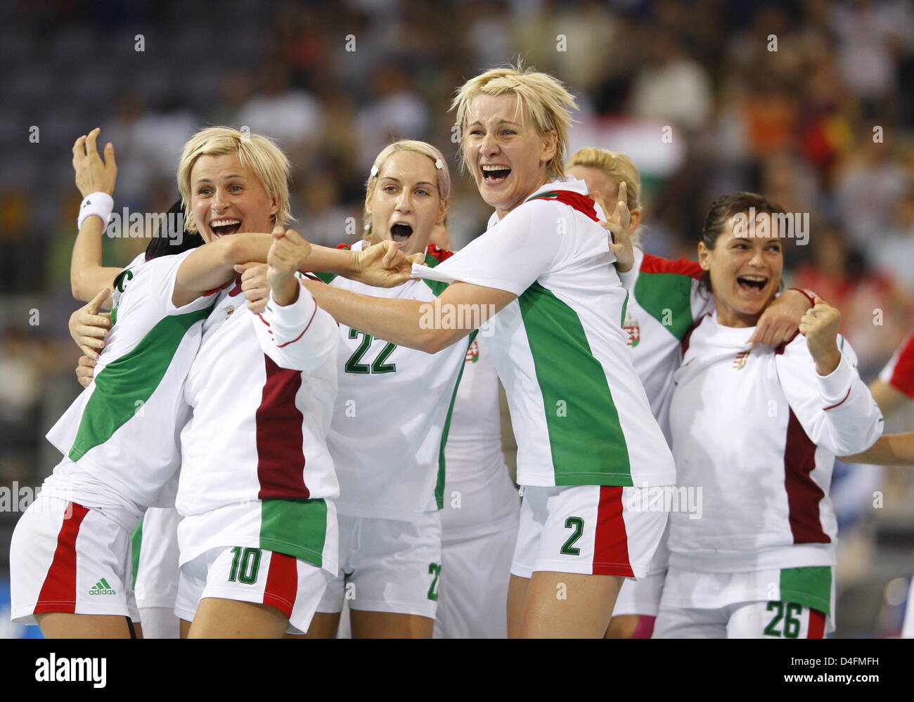 Players of Hungary celebrate their victory after the womenÒs handball ...