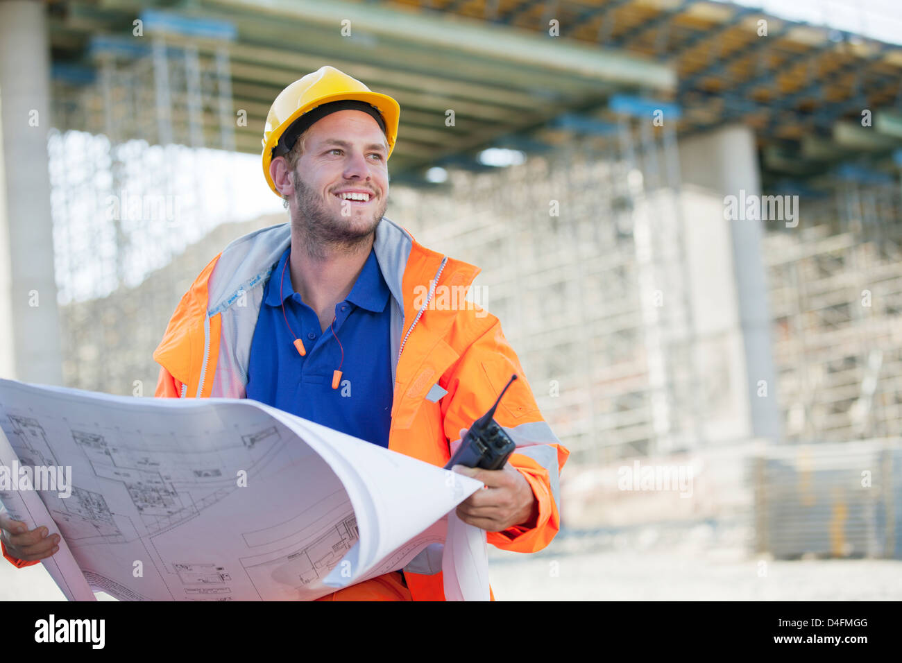 Worker reading blueprints on site hi-res stock photography and images ...