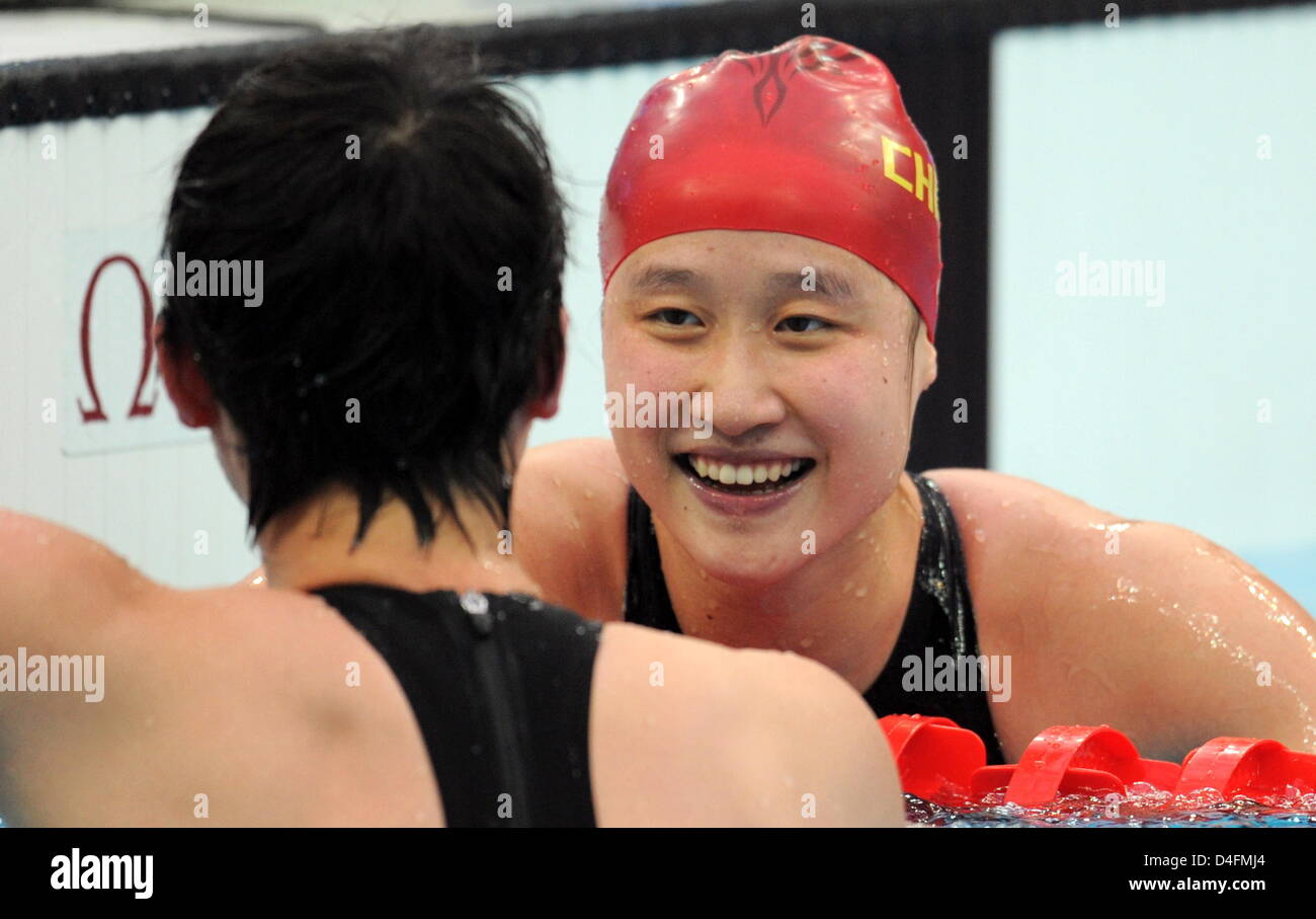 Liu Zige (R) of China reacts after in the women's 200m butterfly final ...