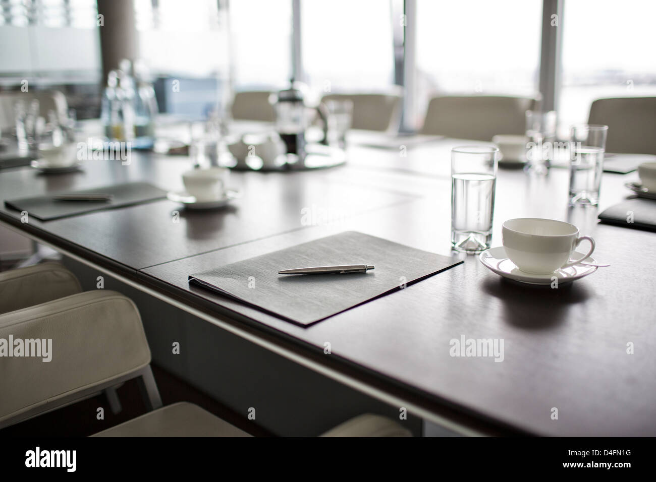Table set for meeting in office Stock Photo - Alamy