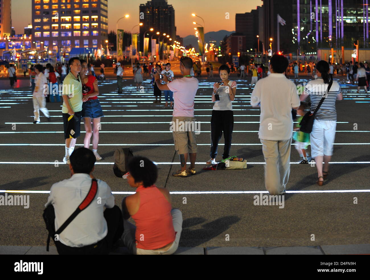 Pedestrian walk along a street on the Olympic Green at the Beijing 2008 ...
