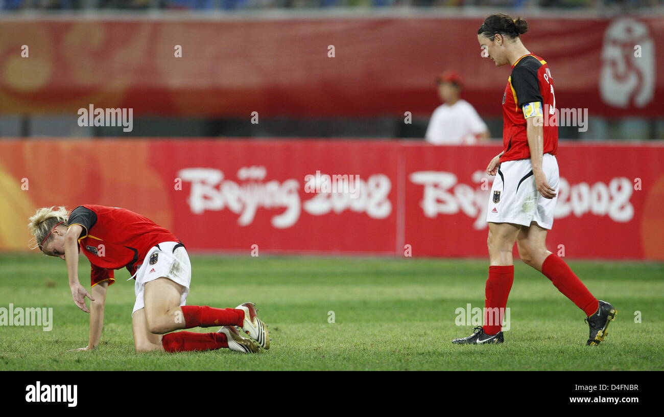 Birgit Prinz (R) and Anja Mittag (L) of Germany are seen during the ...