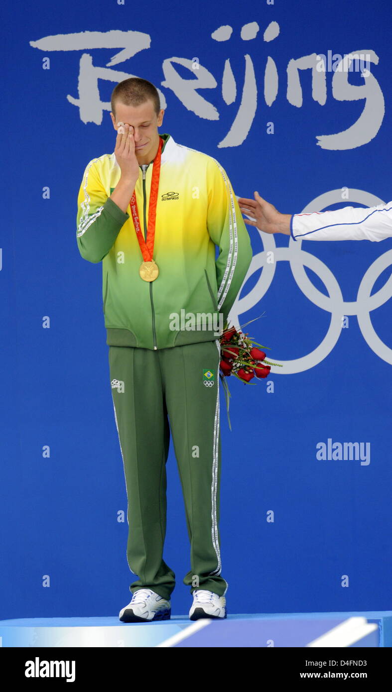 Cesar Cielo Filho from Brazil cries on the podium with his gold medal ...