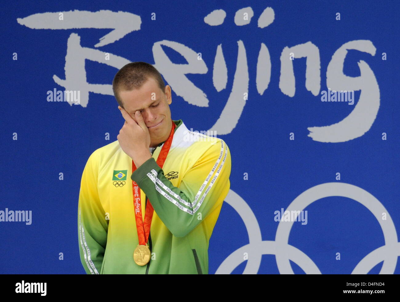 Cesar Cielo Filho from Brazil cries on the podium with his gold medal ...