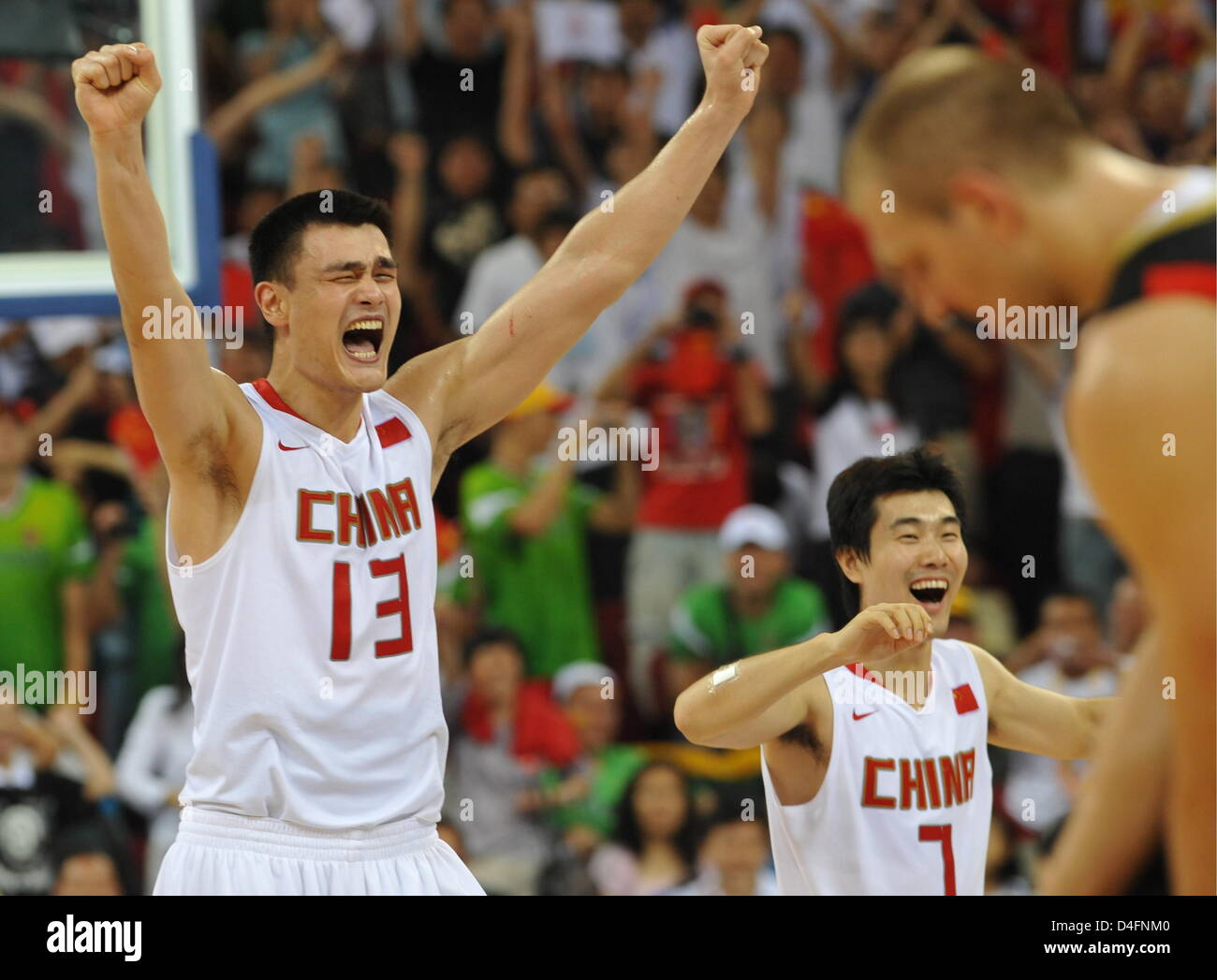 Yao Ming (L) and Wang Shipeng (C) of China jubilate next to Dirk ...