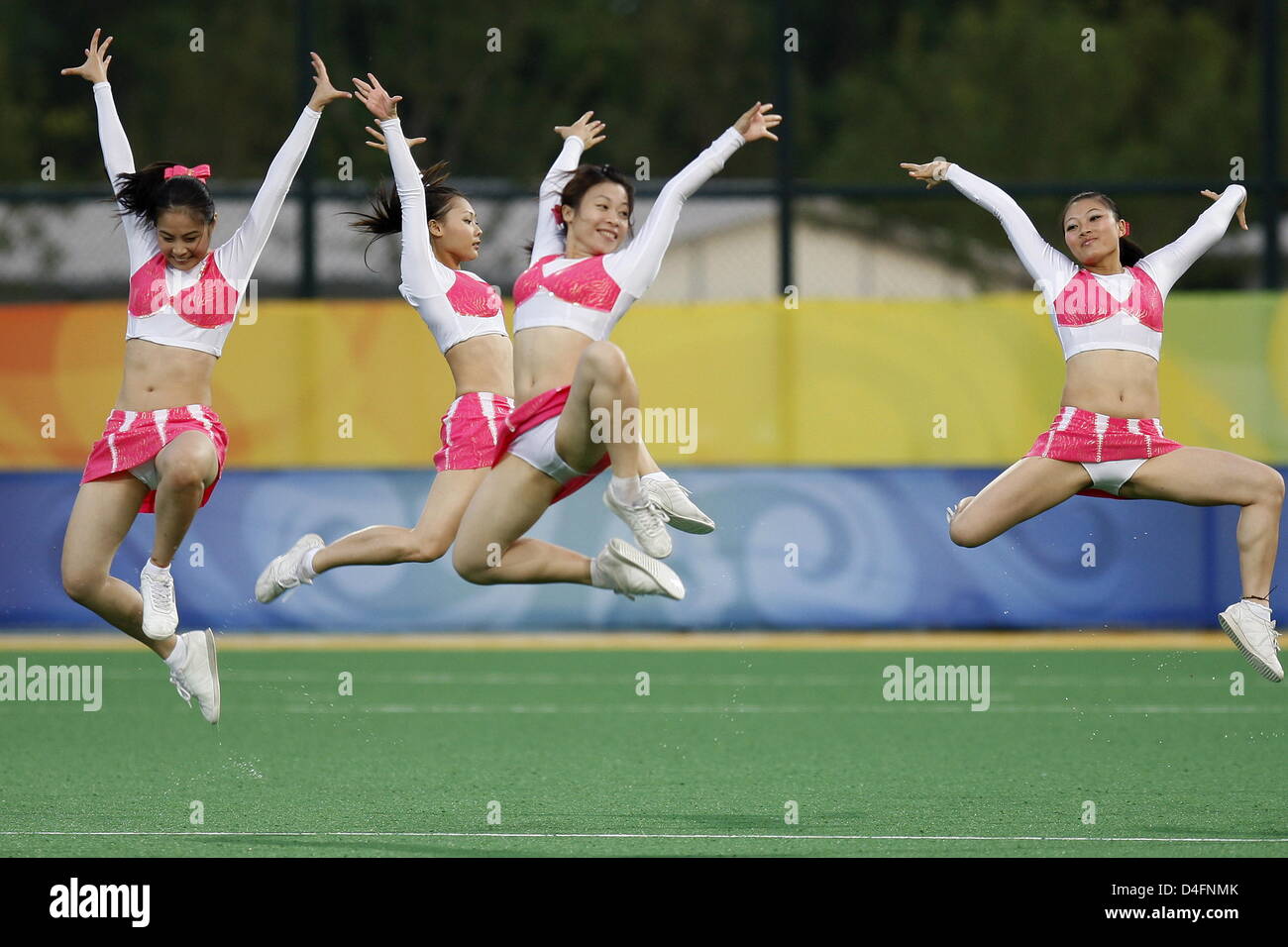 Cheerleaders are seen in a break during the womenÒs hockey preliminary ...