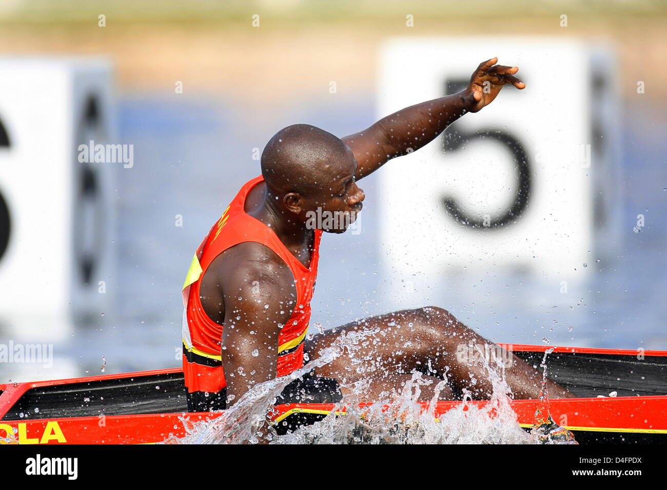 Luis Fortunato Pavavira from Angola falls out of his boat behind the ...