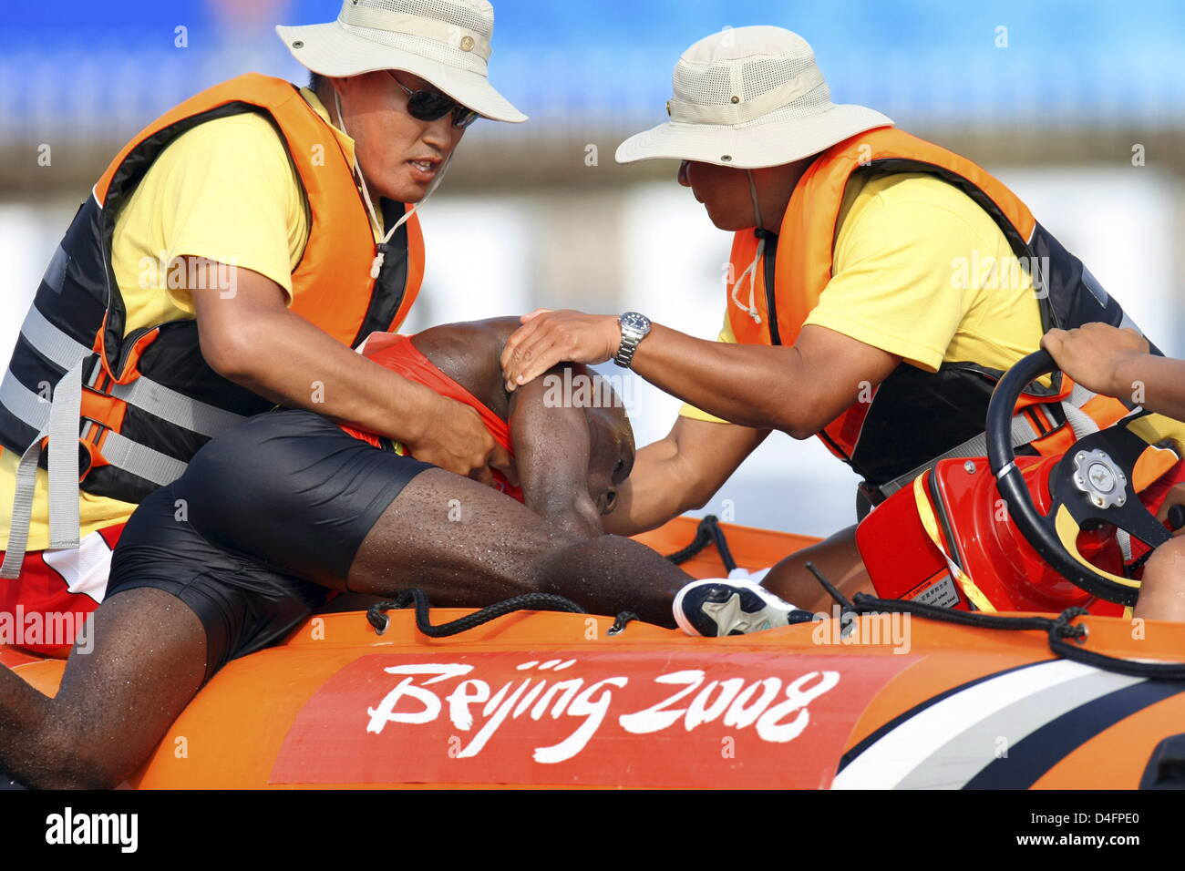 Luis Fortunato Pavavira from Angola is helped into the life boat after ...