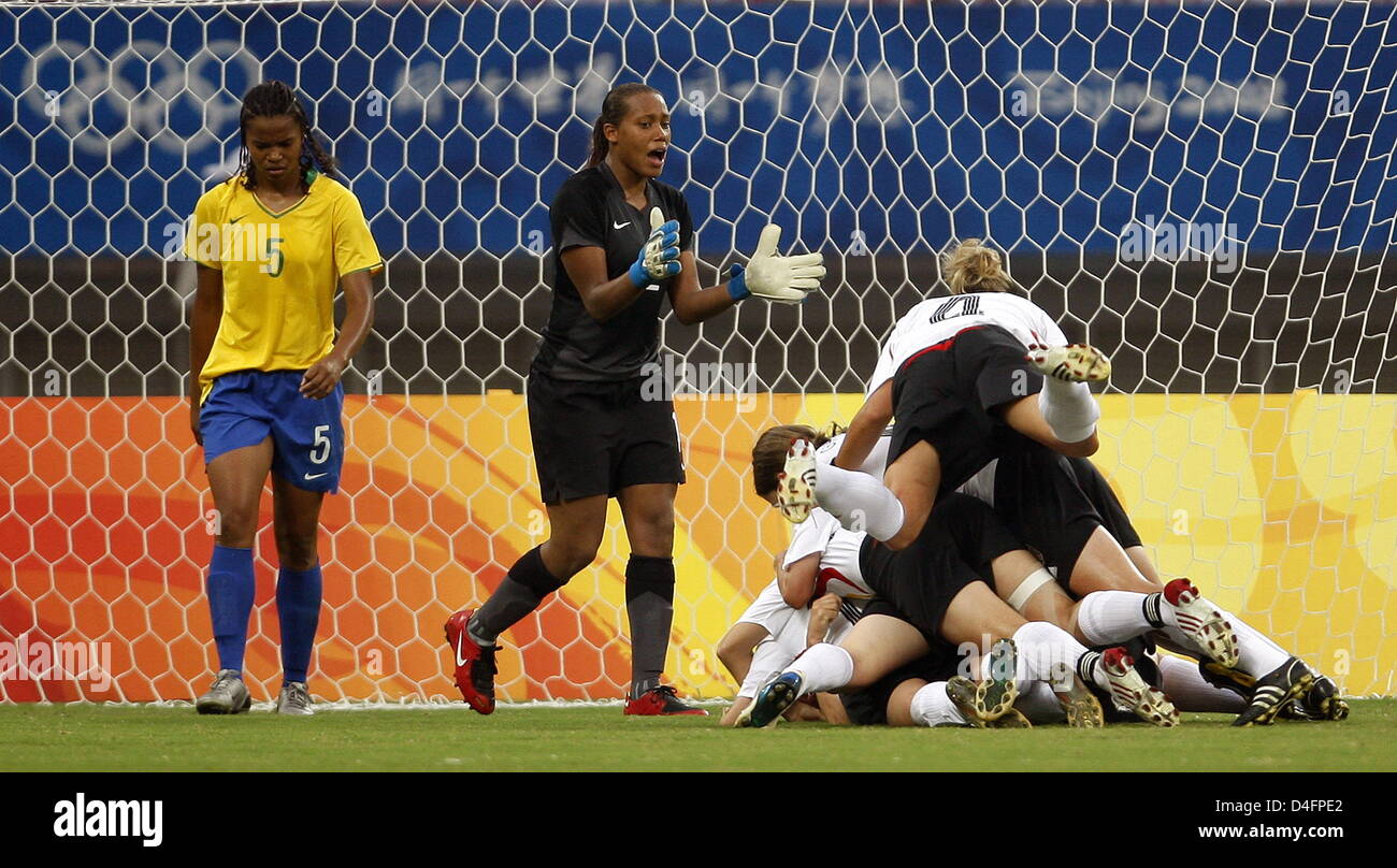 Players of Germany celebrates a goal next to goalkeeper Barbara (2nd L ...