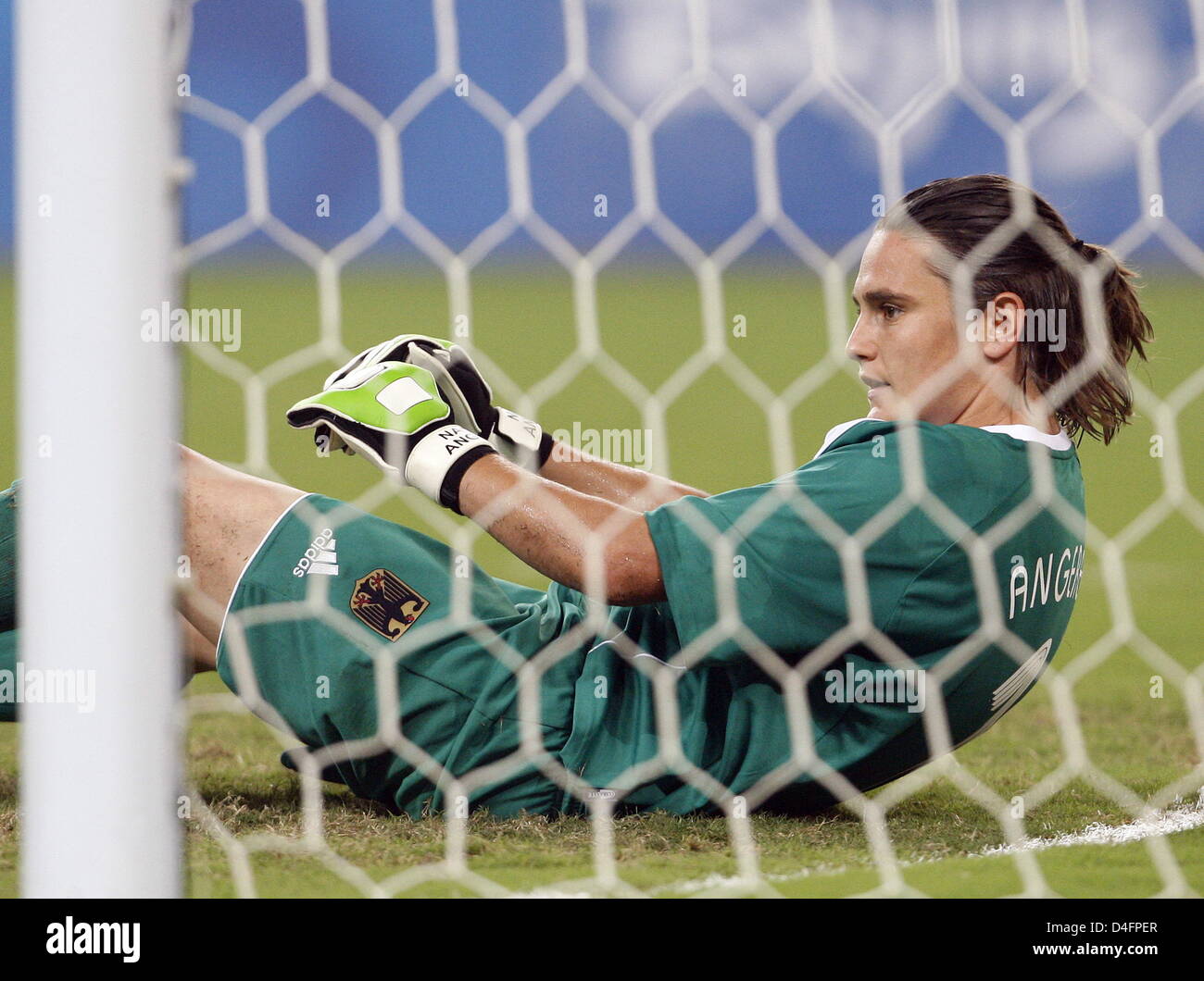Goalkeeper Nadine Angerer of Germany lies on the ground during the ...