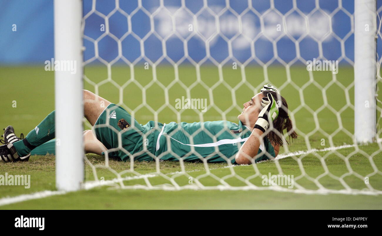 Goalkeeper Nadine Angerer of Germany lies on the ground during the ...