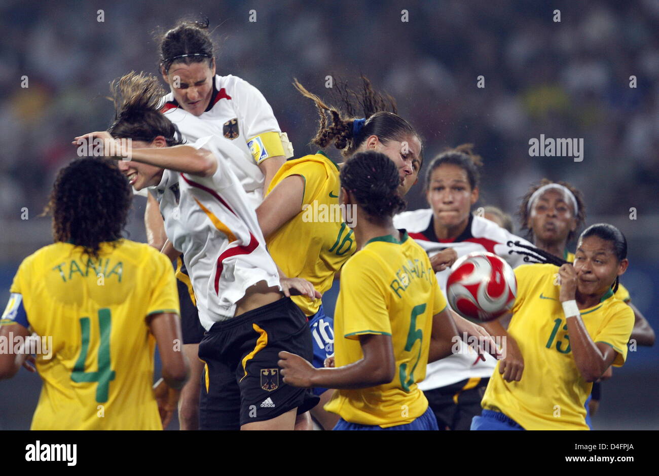 Birgit Prinz (3rd L) from Germany heads the ball during the women's ...
