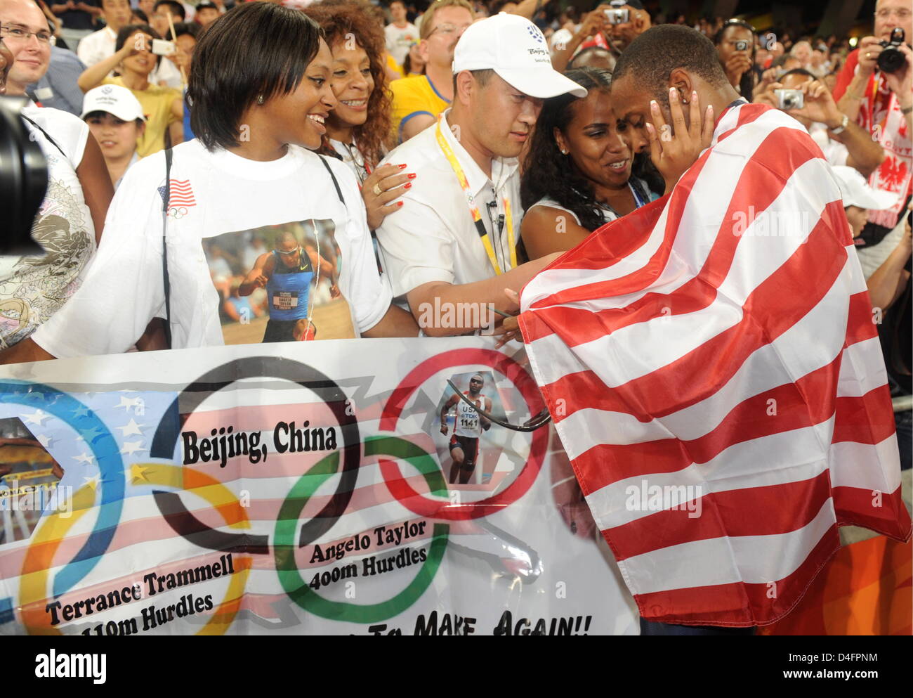 Angelo taylor celebrates winning the mens 400m hurdles hi-res stock ...