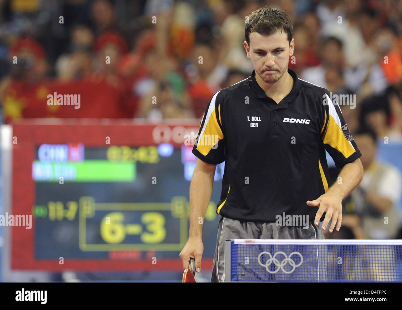 Timo Boll from Germany looks dejected during the Men's Team Gold Medal ...