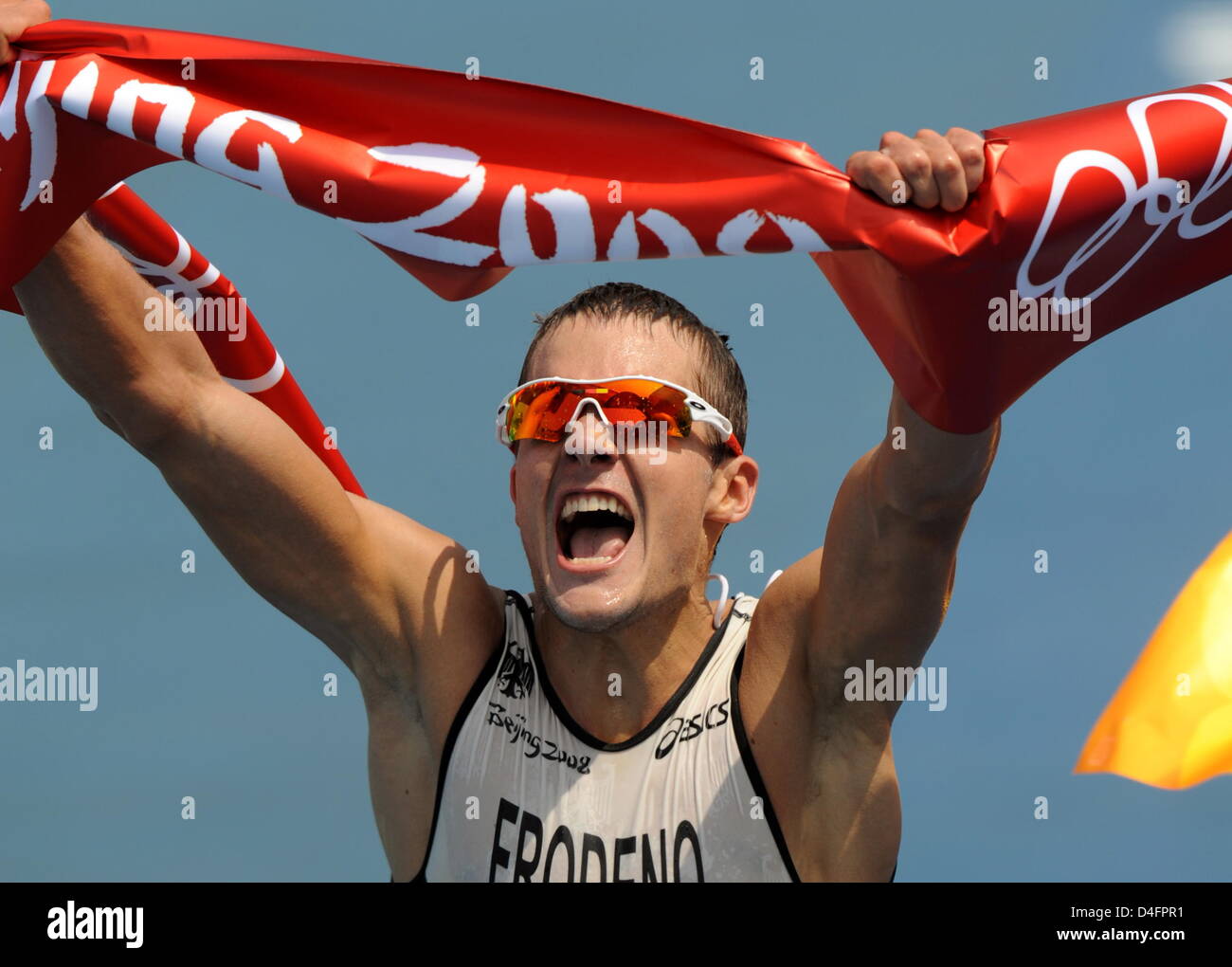 Jan Frodeno from Germany celebrates winning the Gold medal shortly ...
