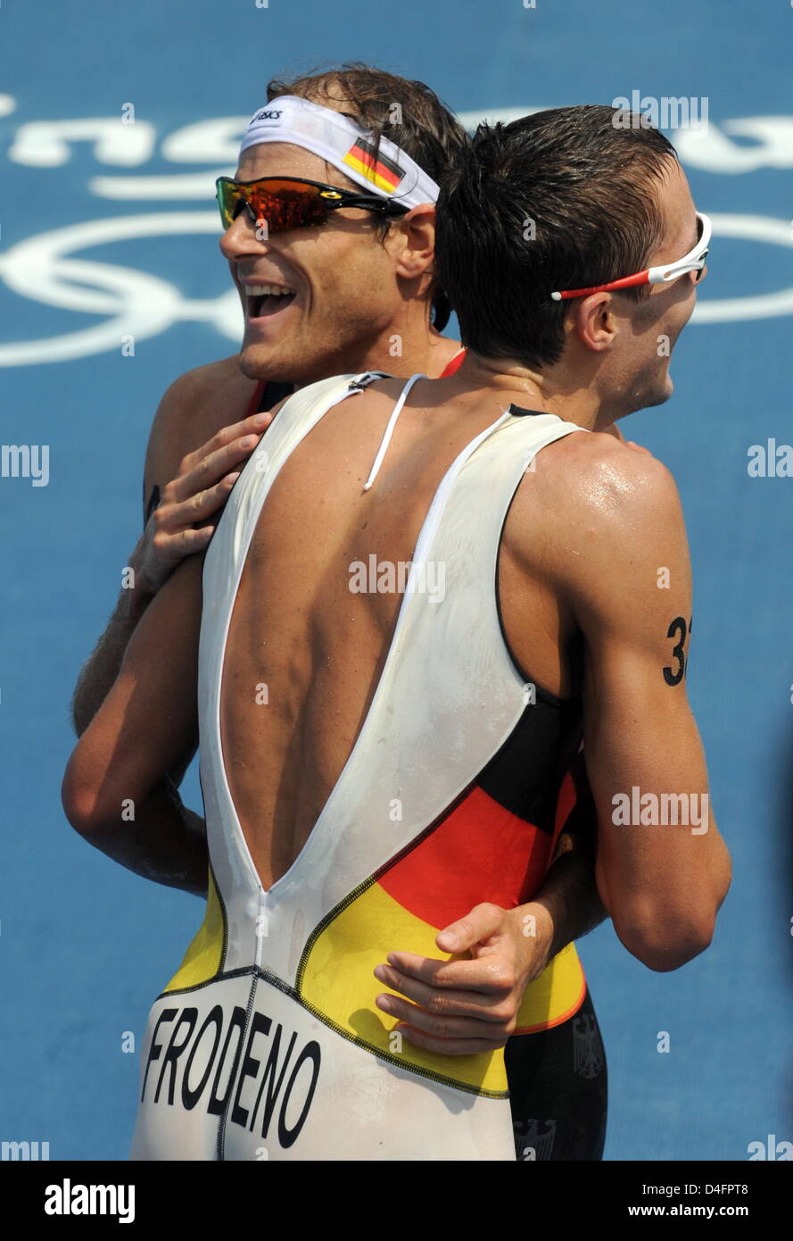 Jan Frodeno (front) from Germany celebrates winning the Gold medal with ...